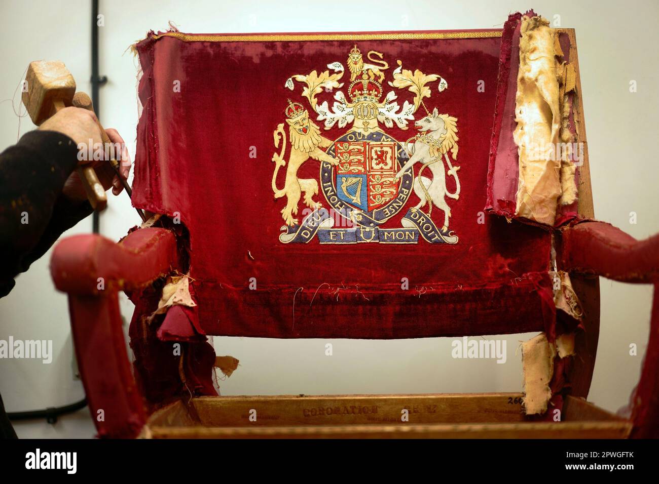 A upholsterer works on restoring a throne chair at the Marlborough ...