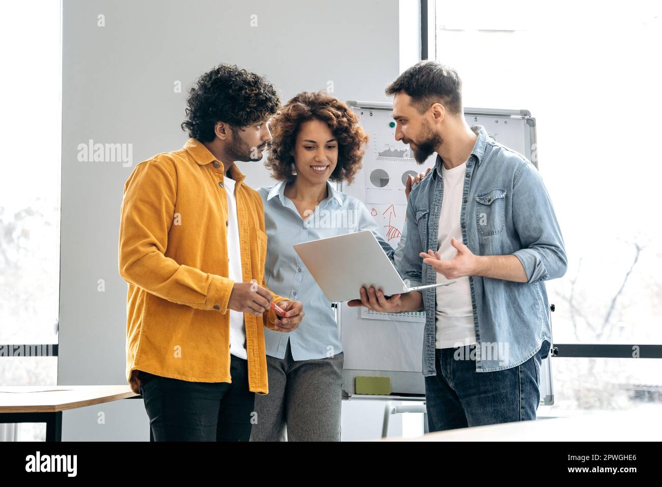 Group of successful multiracial business colleagues, gathering in ...