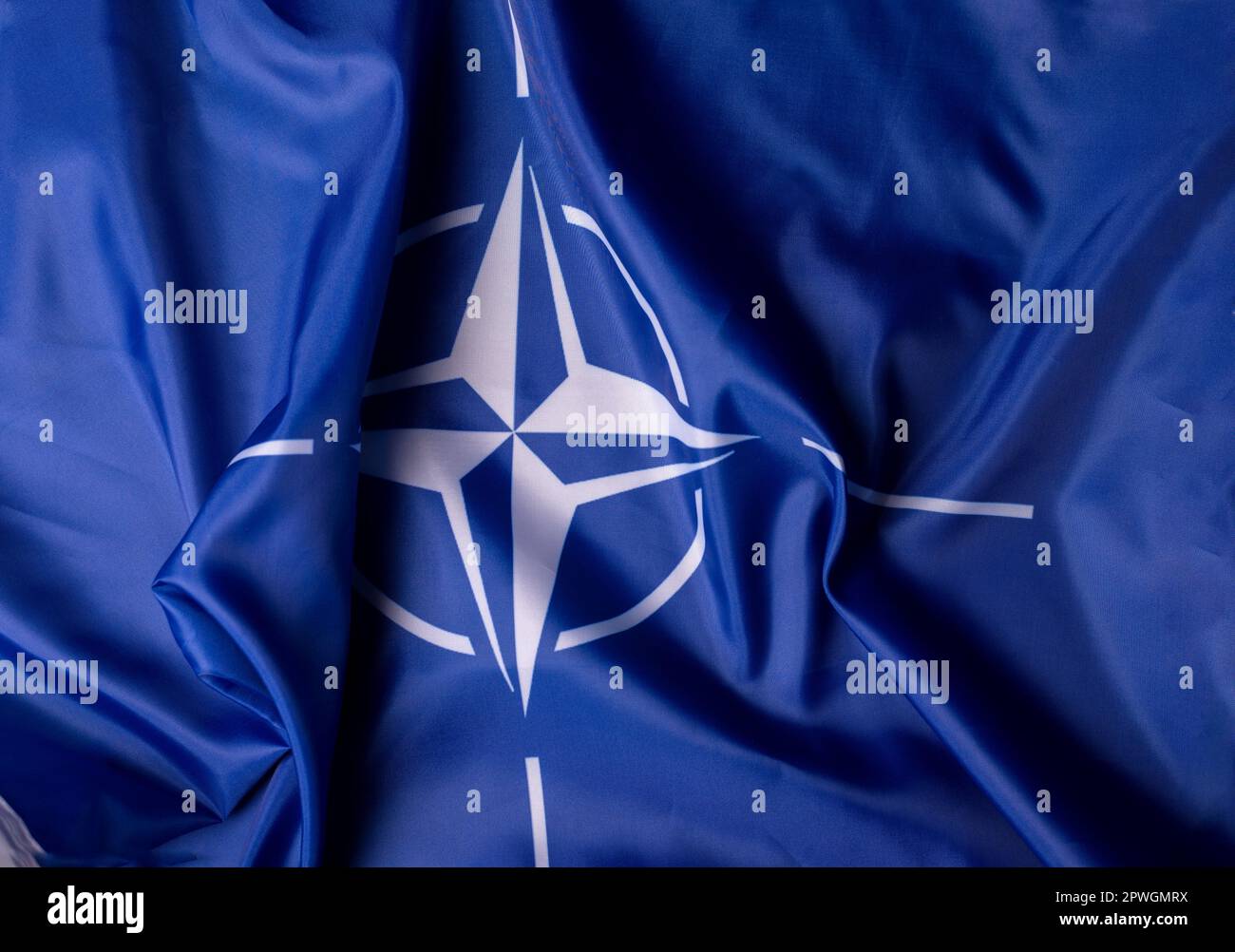 Ukraine, Kyiv - 10.04.2023. Official Flag of NATO against gray ...