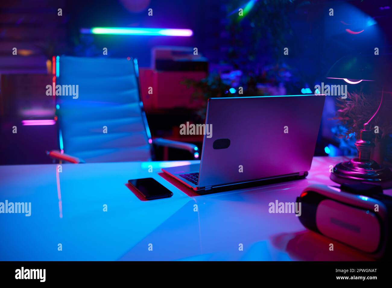Neon metaverse futuristic concept. modern office with desk, laptop and ...