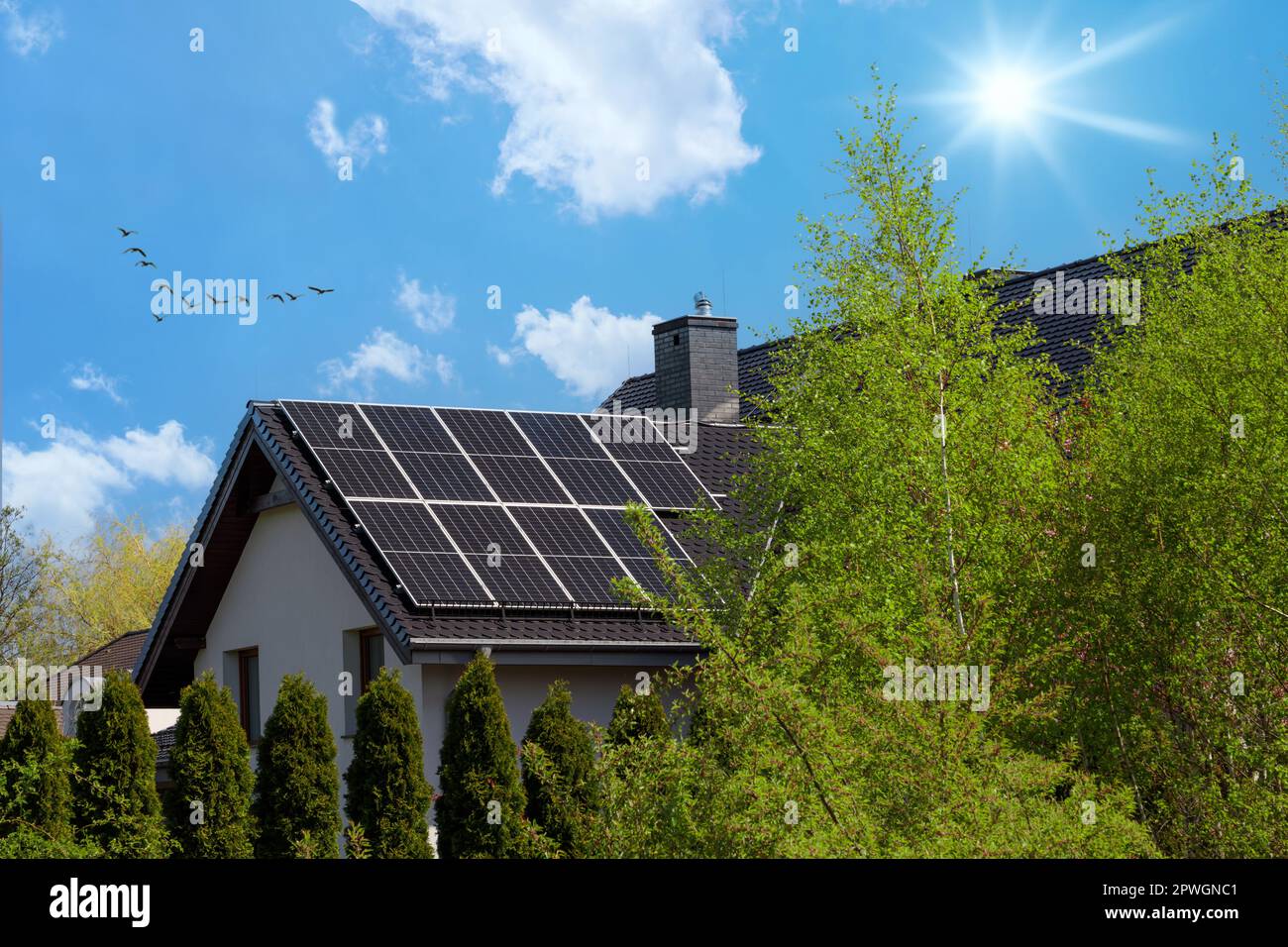 Gable roof with solar panels. Modern, attractive house and solar power ...