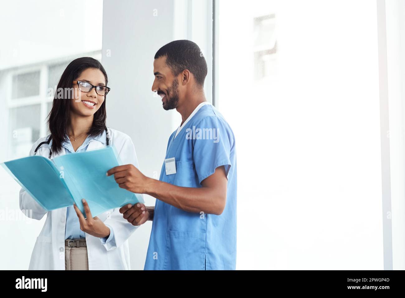 Lets talk alternative treatments. two young doctors discussing the ...