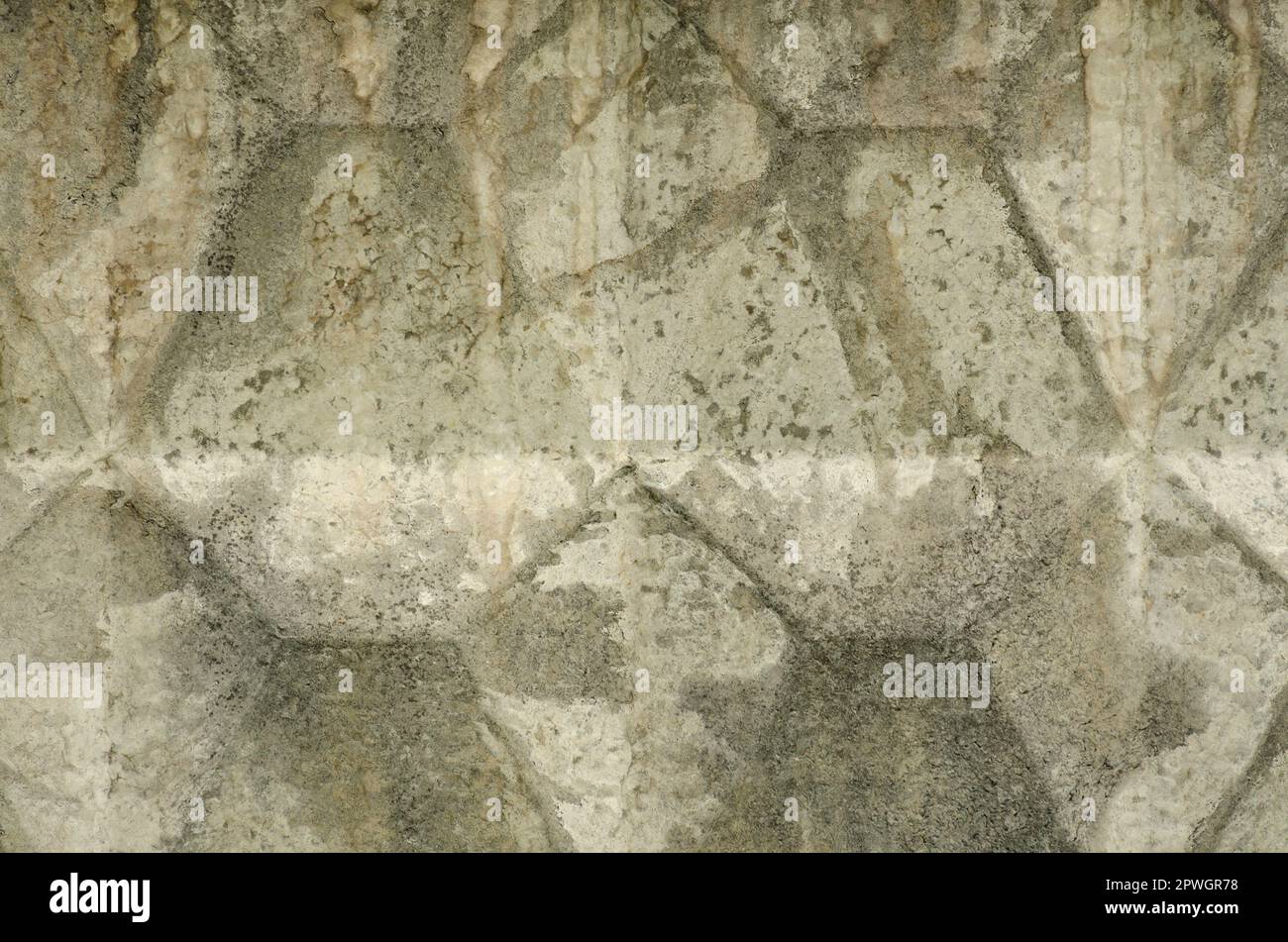 Abstract texture, gray concrete fence. Concrete trapezoid paver blocks ...