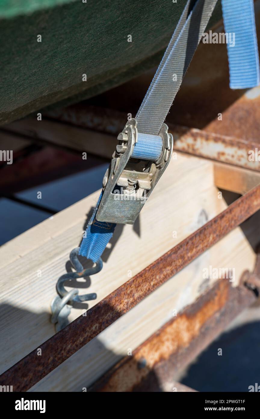 Aged ratchet strap in use and under tension in the outdoors Stock Photo ...