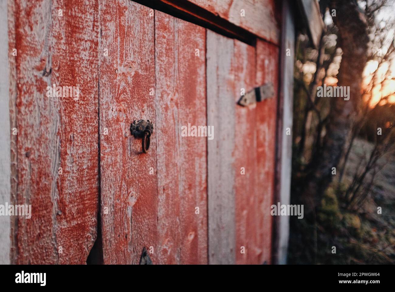 Details of Tiny red wooden cabin in a sunset light Stock Photo - Alamy