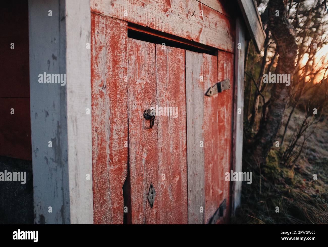 Details of Tiny red wooden cabin in a sunset light Stock Photo - Alamy