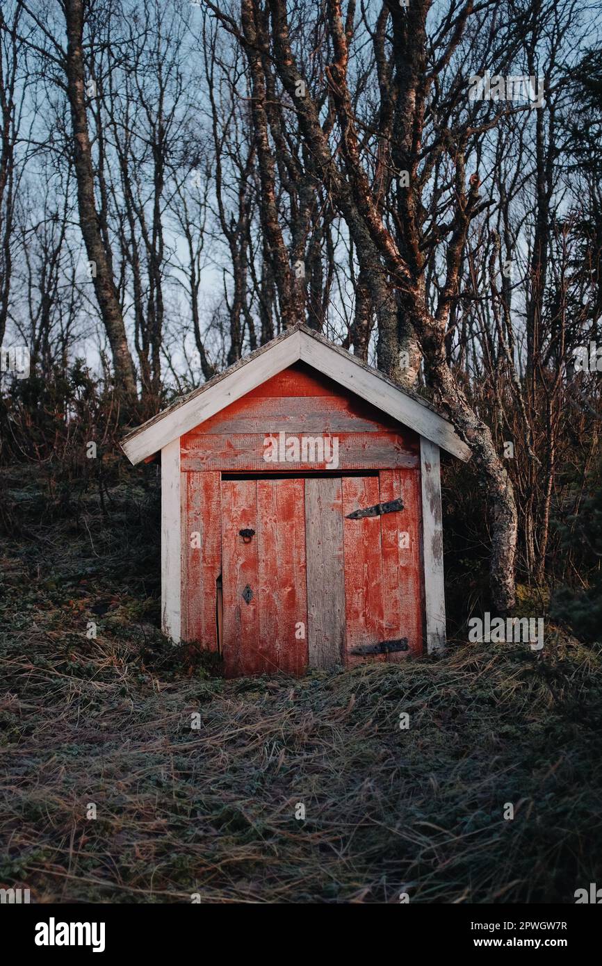 Details of Tiny red wooden cabin in a sunset light Stock Photo - Alamy