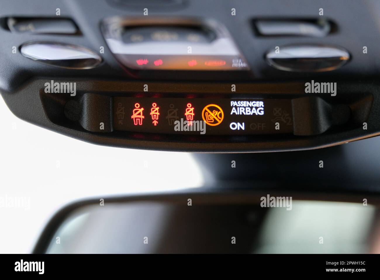 Seat belt and passenger airbag light showing on the car rear view ...