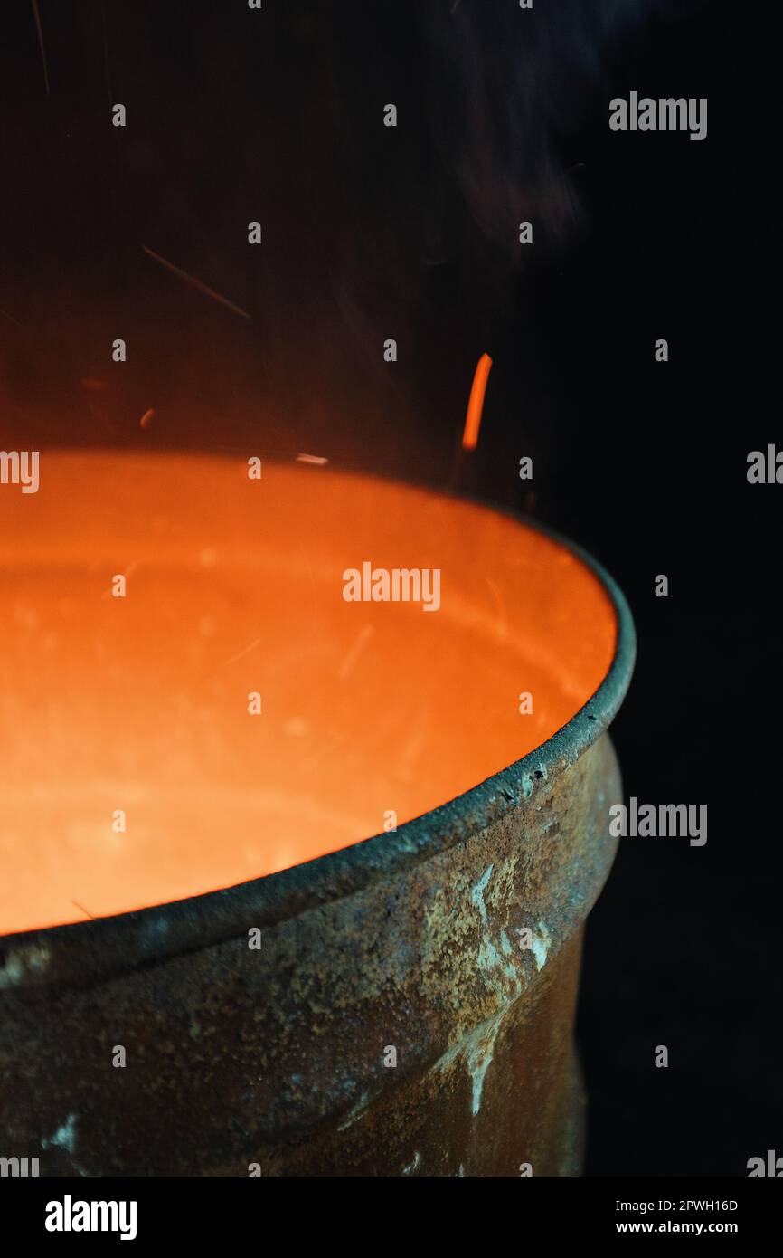 fire burning inside a metal barrel Stock Photo - Alamy