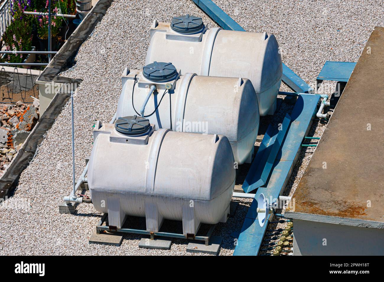 Cylindrical Plastic Tanks for Water on the Roof Stock Photo - Alamy