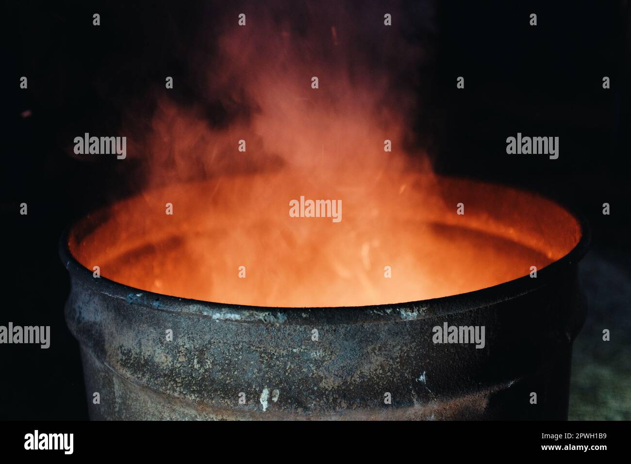 fire burning inside a metal barrel Stock Photo - Alamy