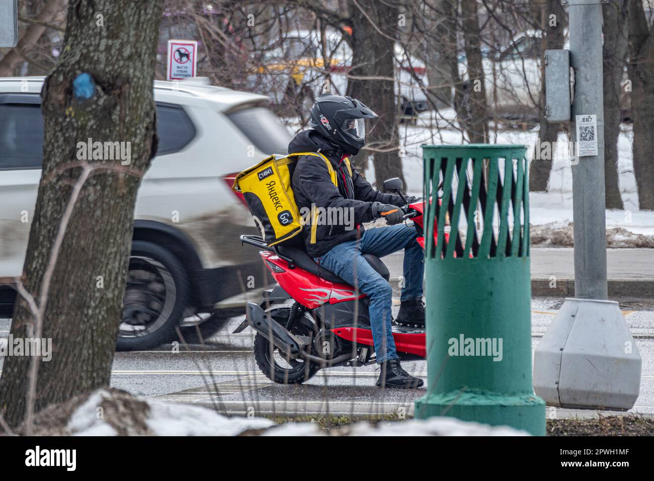 Russia, Moscow. An employee of the Yandex.Go food delivery service ...