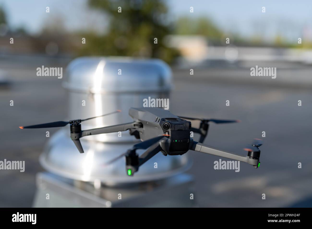 Drone being used to perform an aerial inspecting of HVAC RTU equipment ...