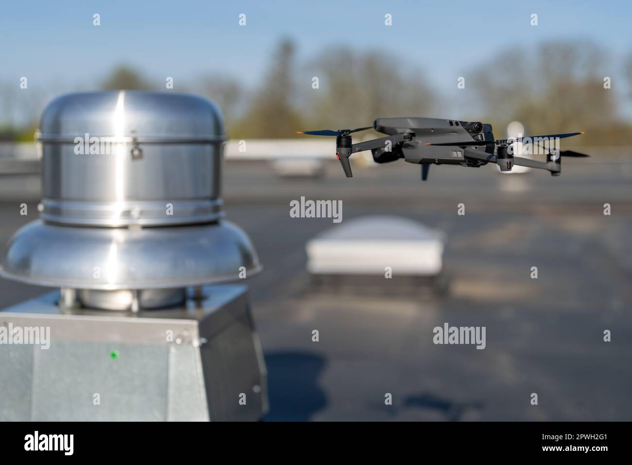 Drone being used to perform an aerial inspecting of HVAC RTU equipment ...