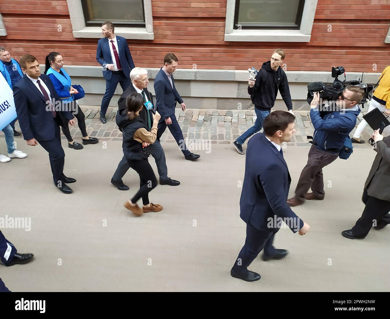 Prime Minister of Latvia Krisjanis Karins (center) surrounded by ...