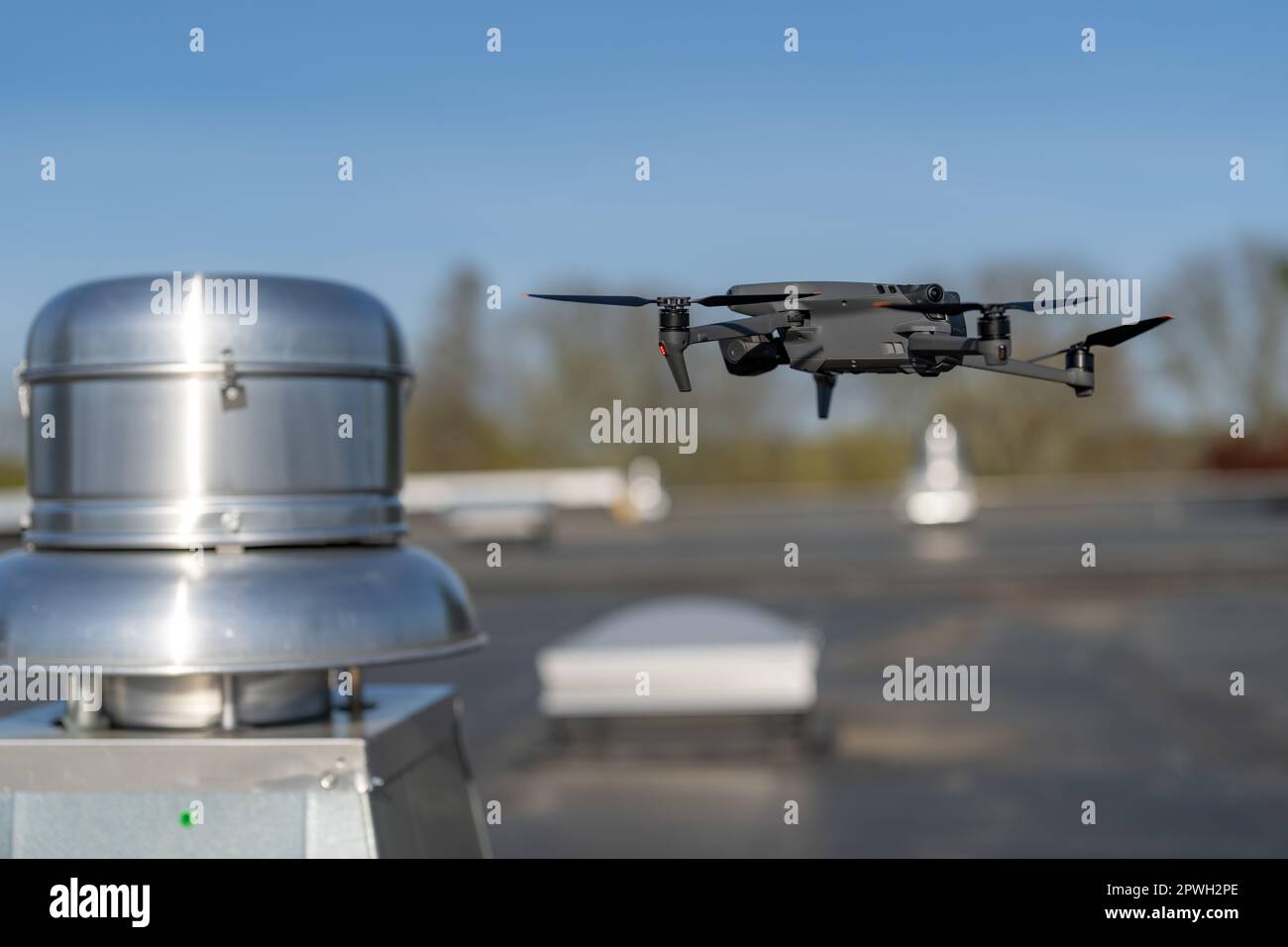 Drone being used to perform an aerial inspecting of HVAC RTU equipment ...