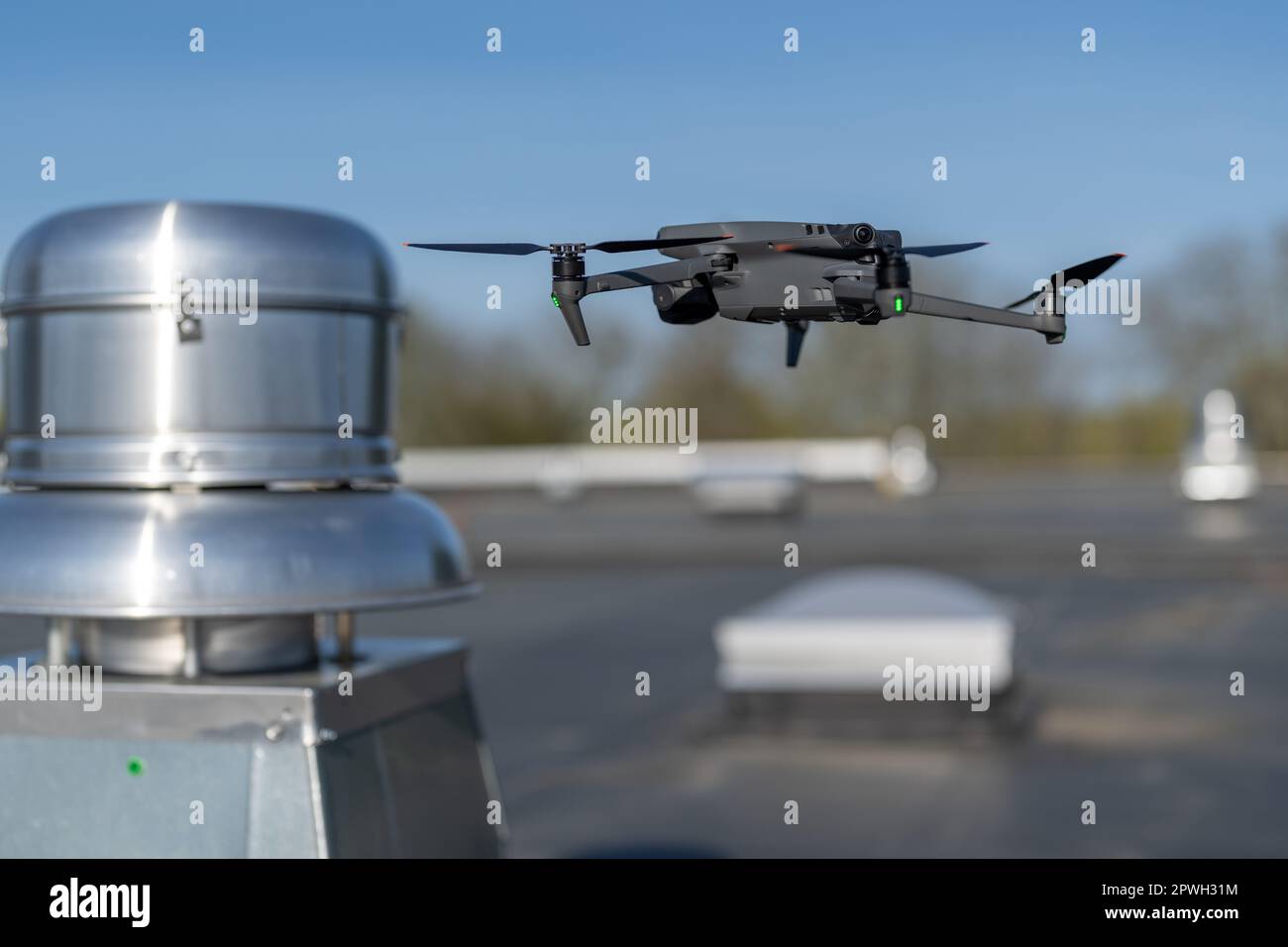 Drone being used to perform an aerial inspecting of HVAC RTU equipment ...
