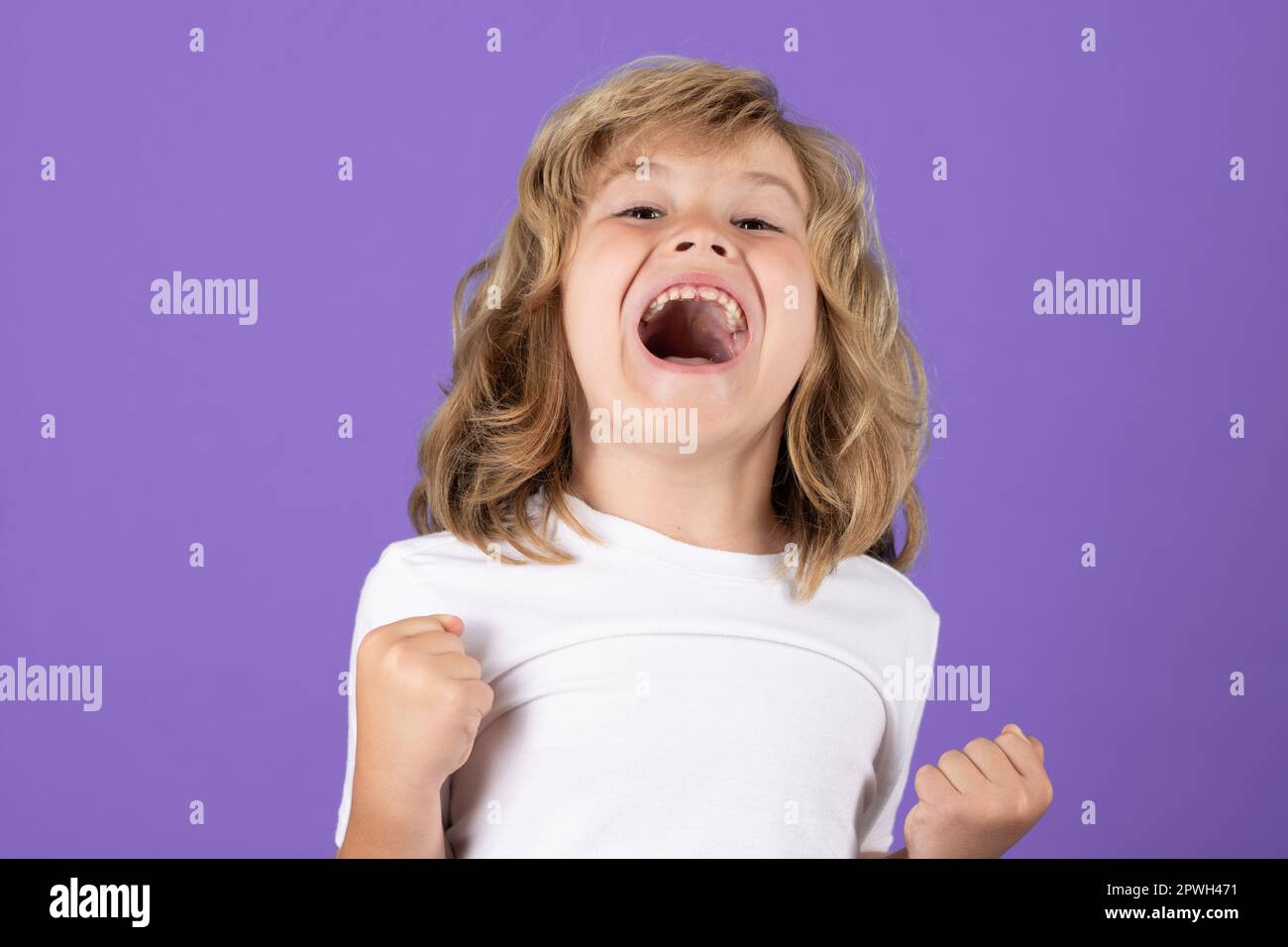 Expression kids face. Excited kid boy on studio isolated background ...