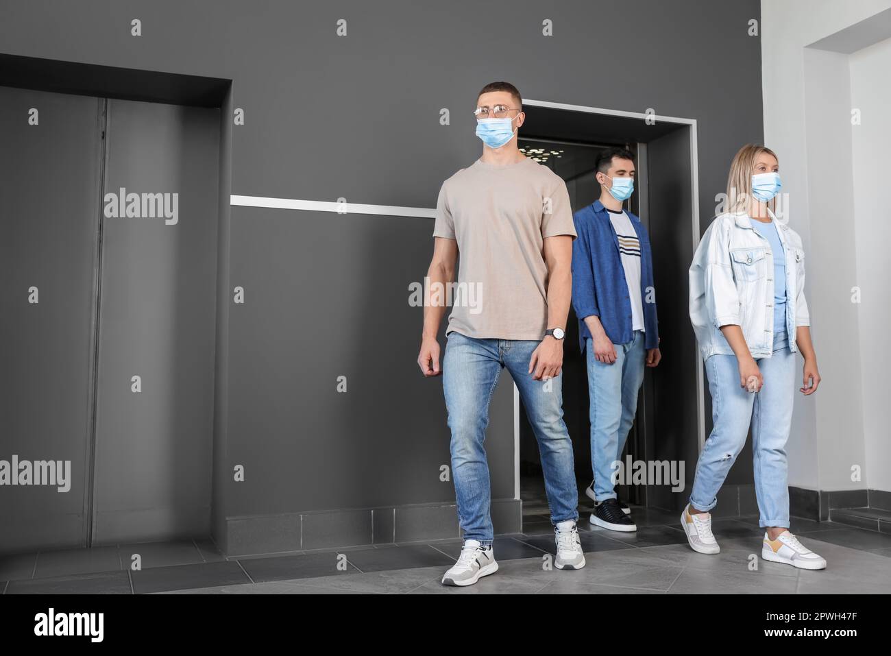 Man walking out elevator hi-res stock photography and images - Alamy