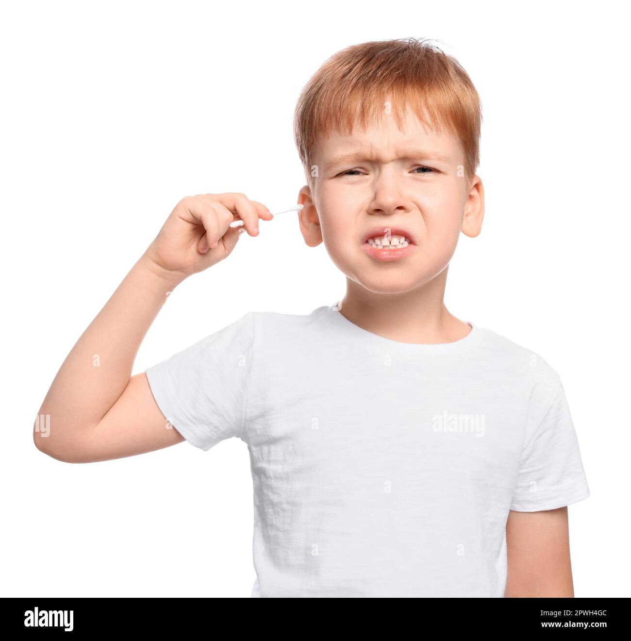 Little boy cleaning ear with cotton swab on white background Stock ...