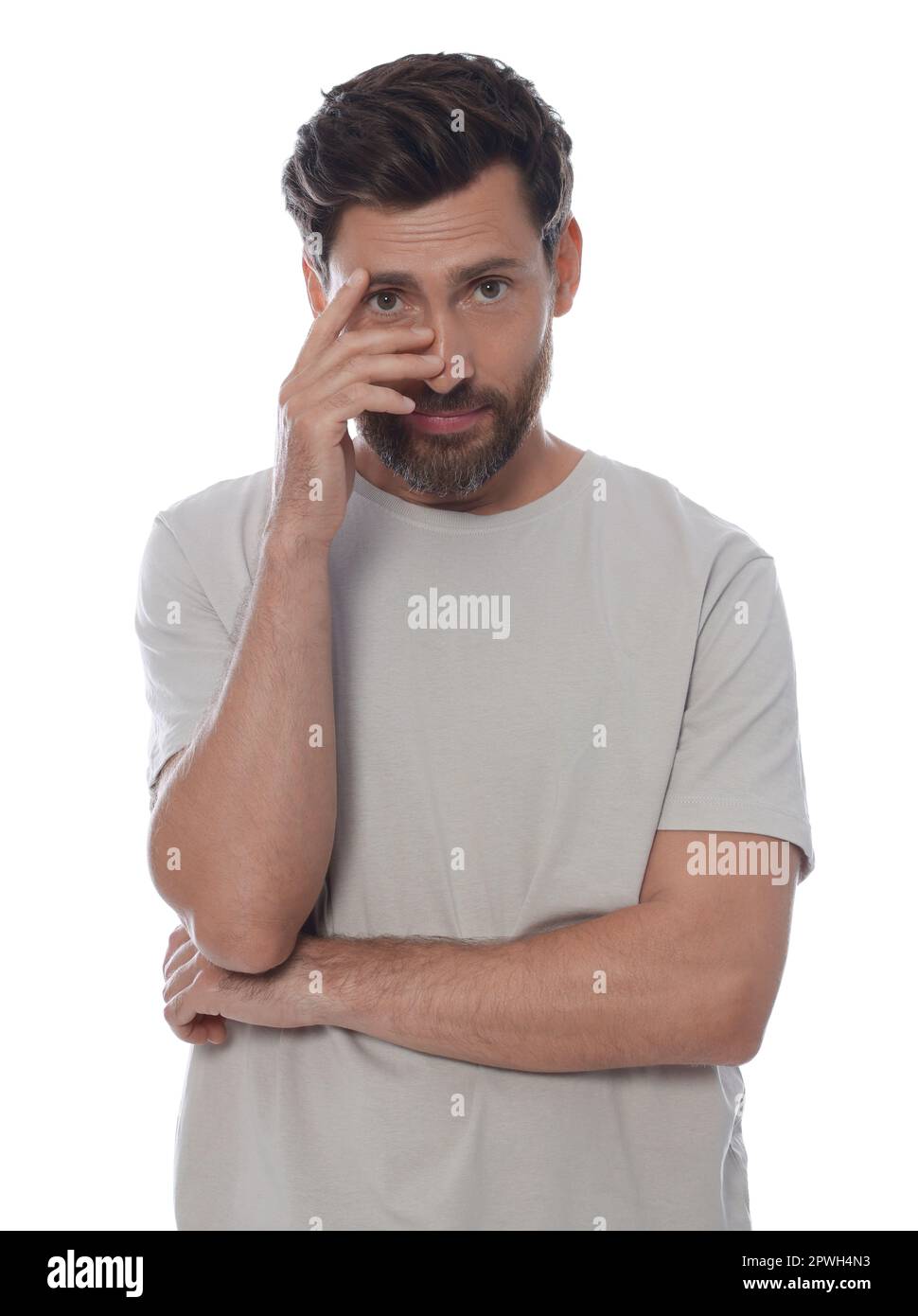 Embarrassed man covering face with hand on white background Stock Photo ...