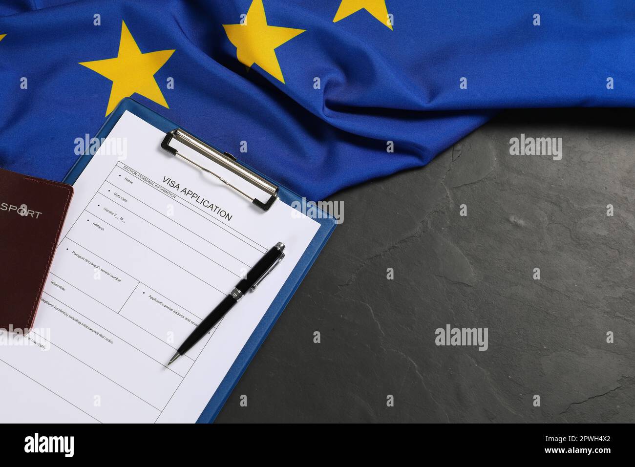 Visa application form, passport, pen and flag of European Union on ...