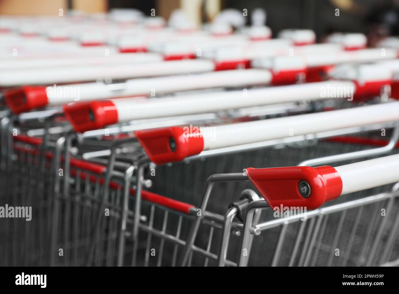 Many empty metal shopping carts, closeup view Stock Photo - Alamy