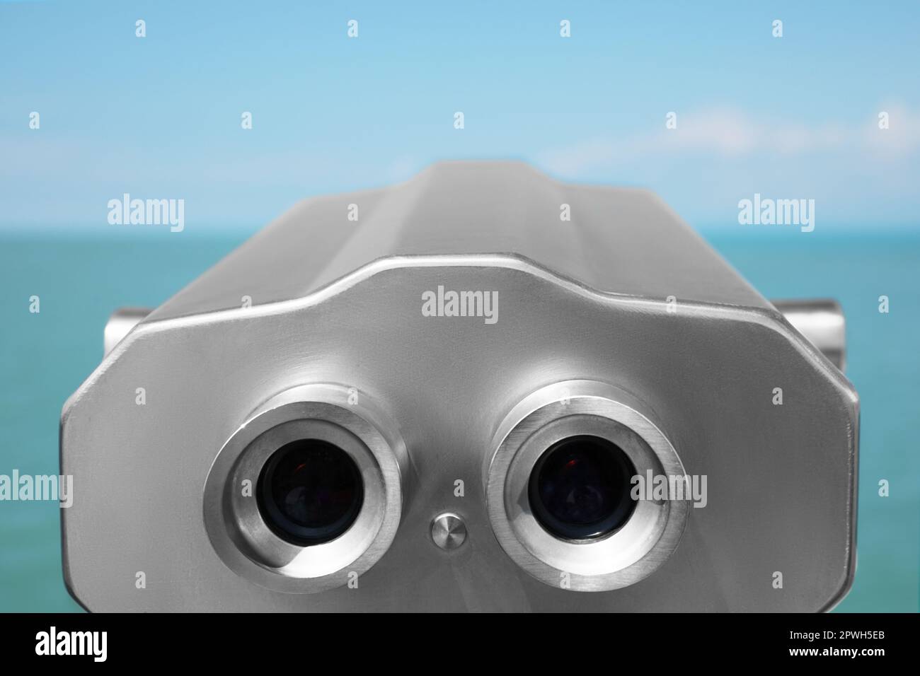 Metal tower viewer installed near sea, closeup. Mounted binoculars ...