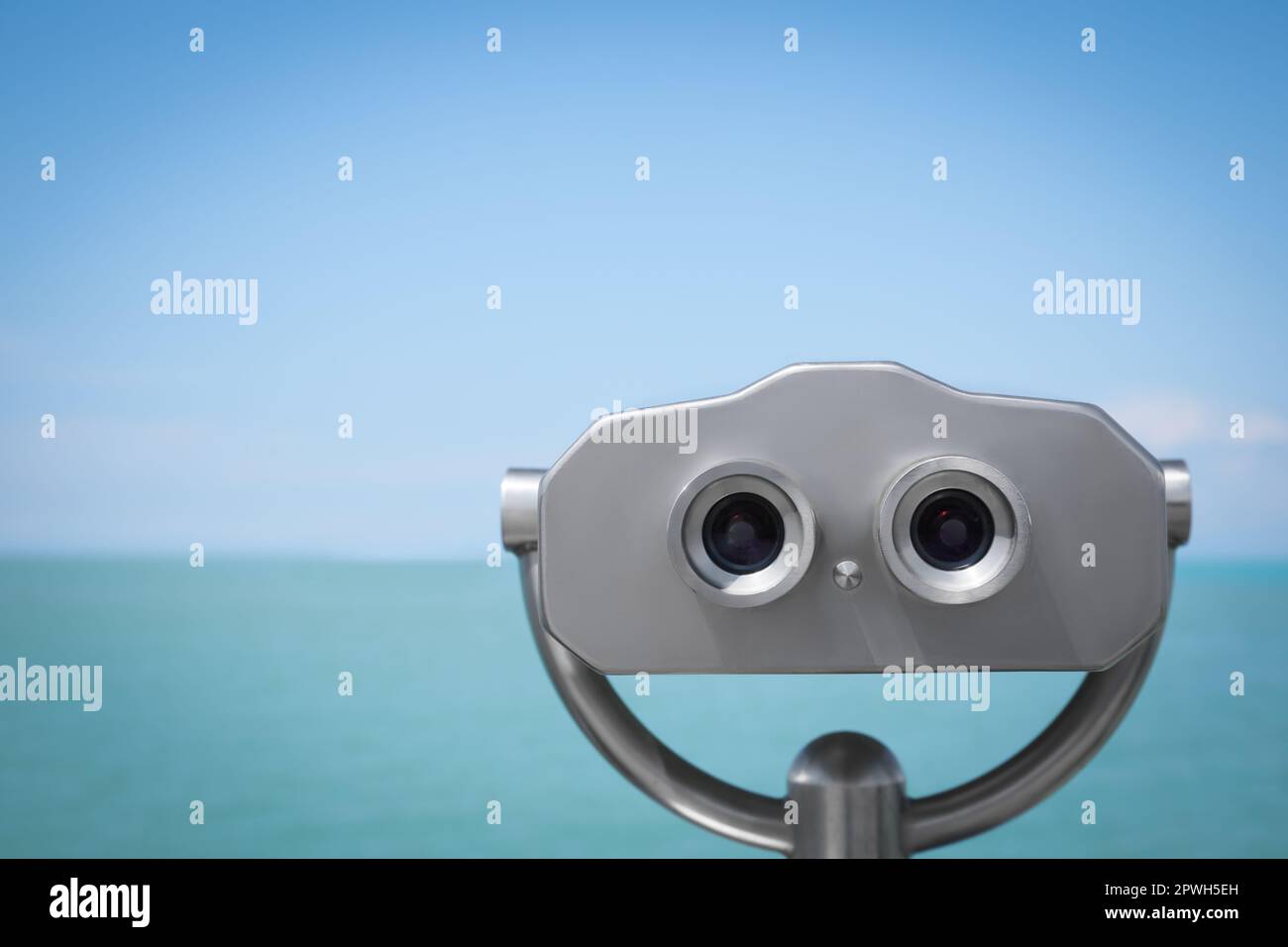 Metal tower viewer installed near sea. Mounted binoculars Stock Photo ...