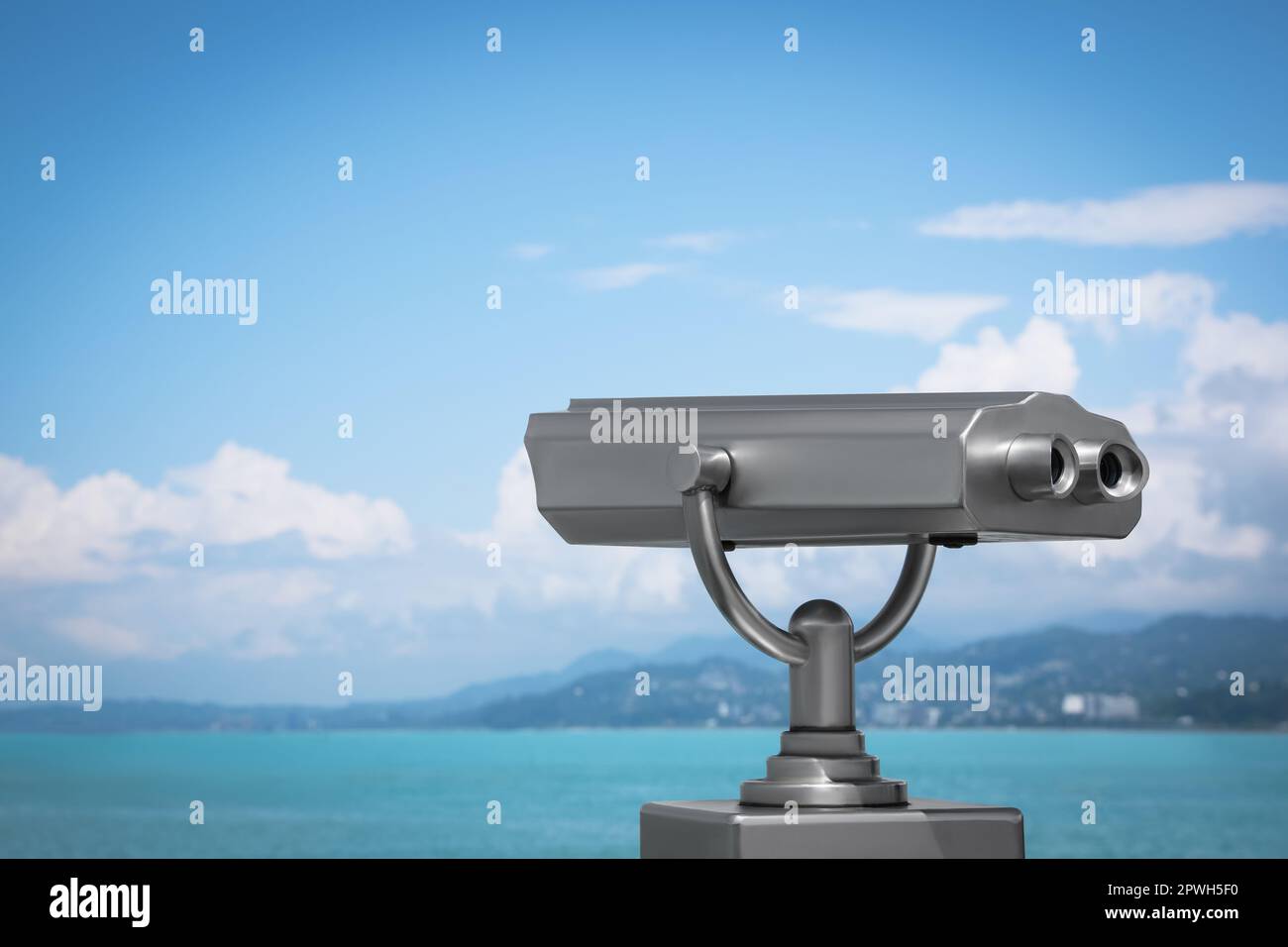Metal tower viewer installed near sea, space for text. Mounted ...