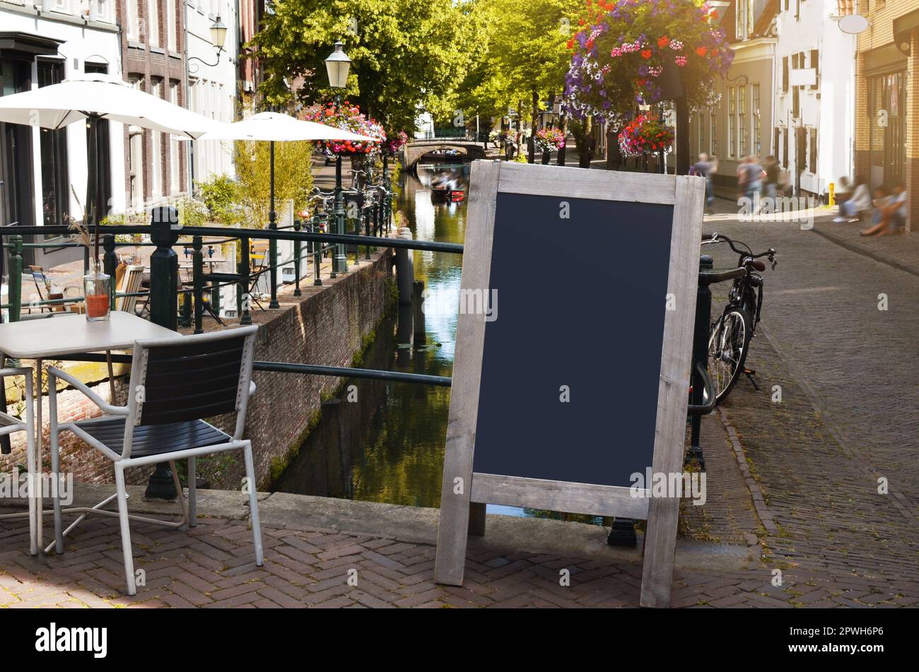 Blank advertising board on city street. Space for design Stock Photo ...