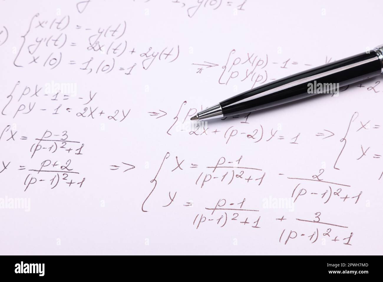 Sheet of paper with mathematical formulas and pen, closeup Stock Photo ...