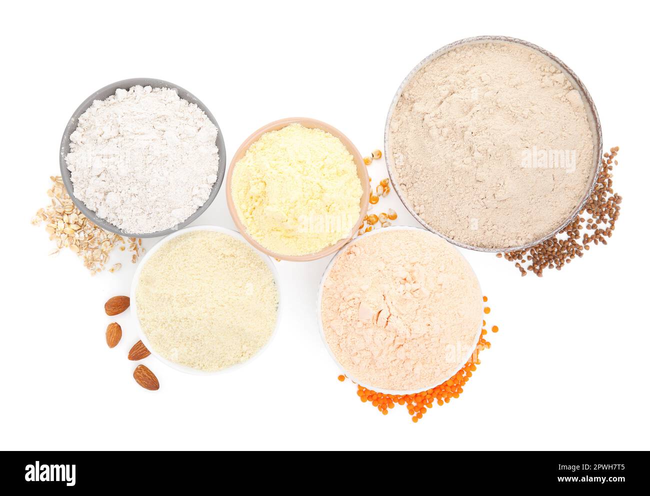 Different types of flour in bowls on white background, top view Stock ...