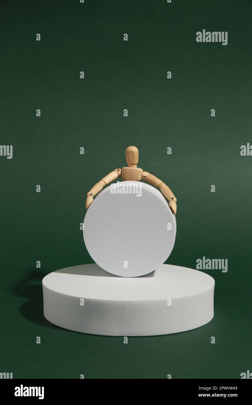 Product photography props. Round shaped podiums and wooden mannequin on ...