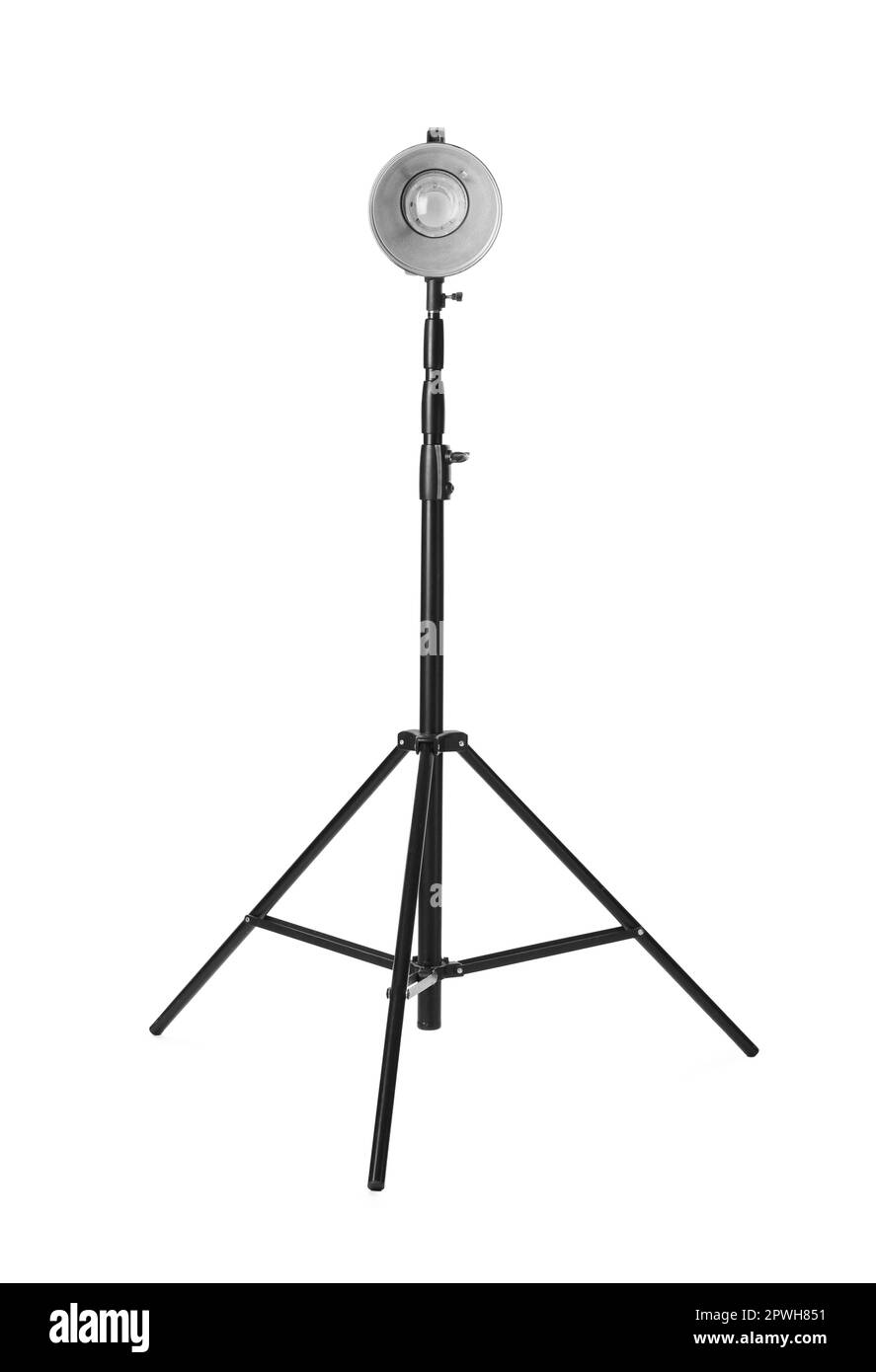 Studio flash light on tripod against white background. Professional ...