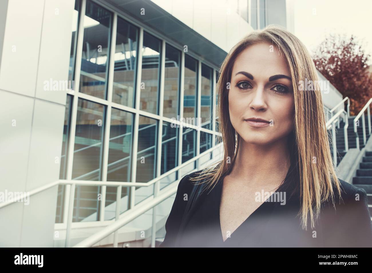 The Leader In Urban Business A Beautiful Young Businesswoman Walking Through The City Stock