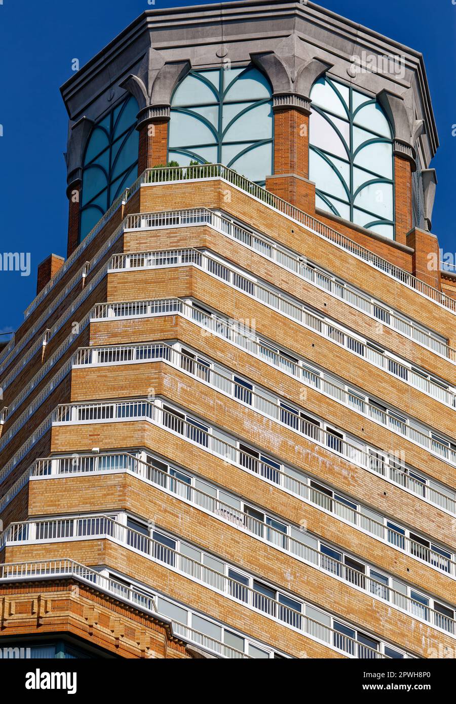 An Egyptian-motif water tank enclosure caps the cascading stepped ...