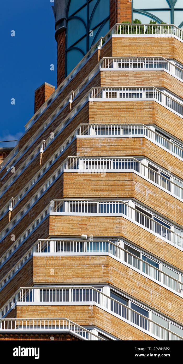 An Egyptian-motif water tank enclosure caps the cascading stepped ...
