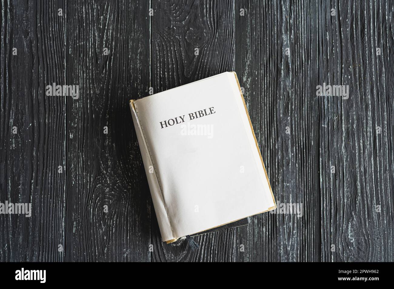 The Bible with spring flowers on a wooden background. Concept for faith ...