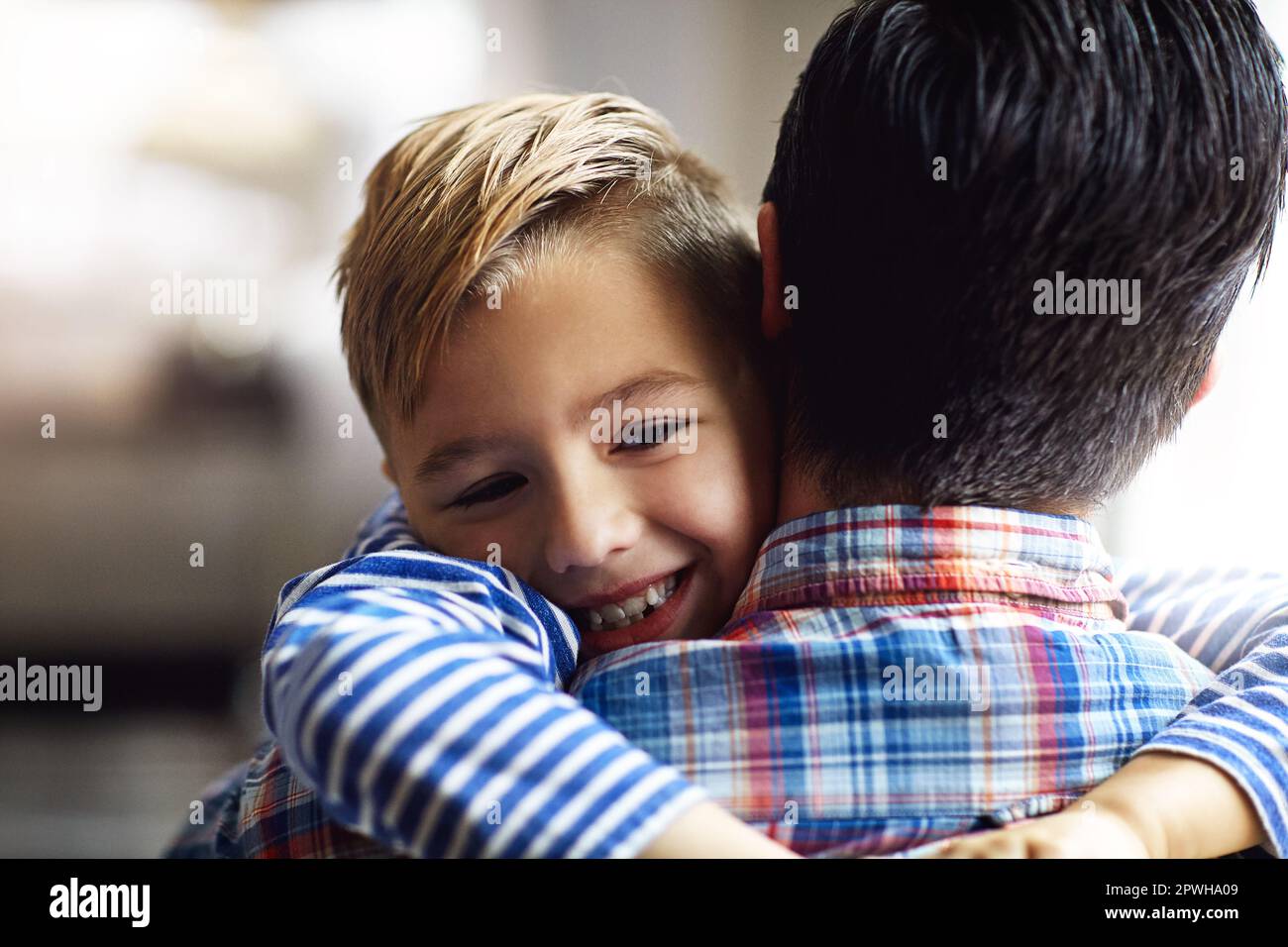 Youre simply the bestest Dad. an adorable little boy hugging his father ...