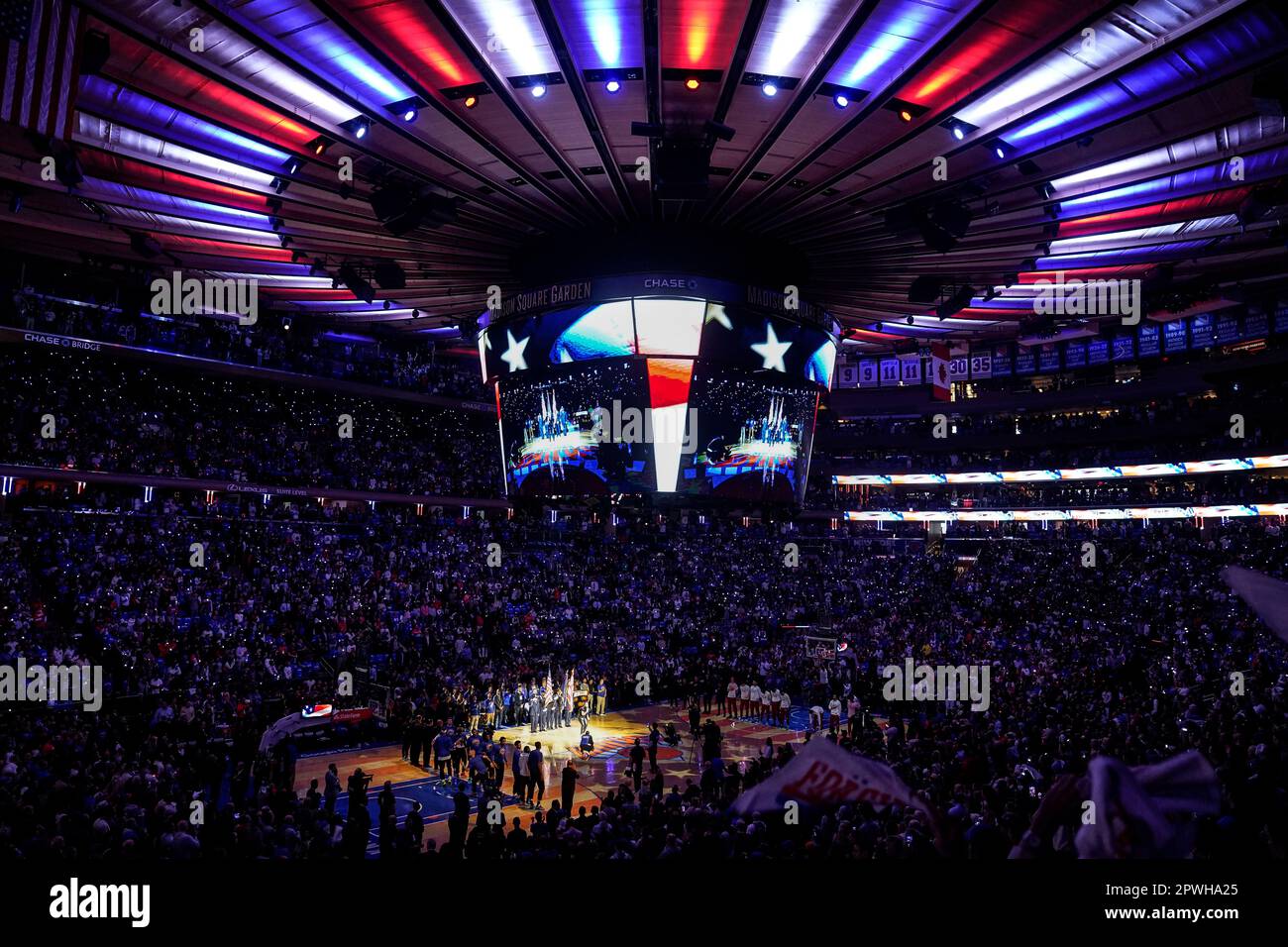 The audience at Madison Square Garden rises for the national anthem ...