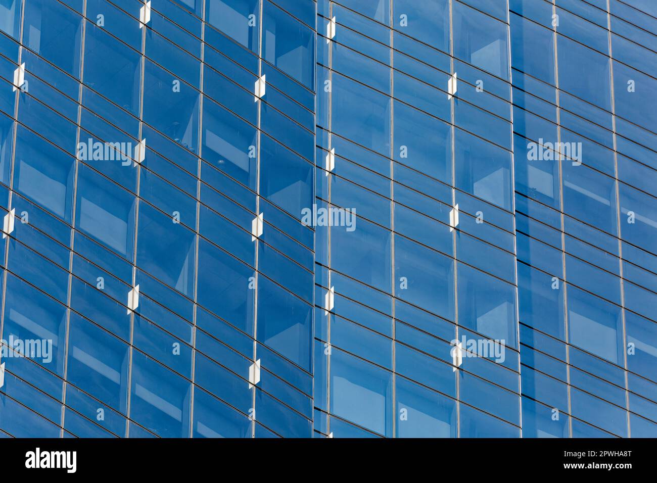 The blue glass curtain wall of Deutsche Bank Center’s North Tower is ...