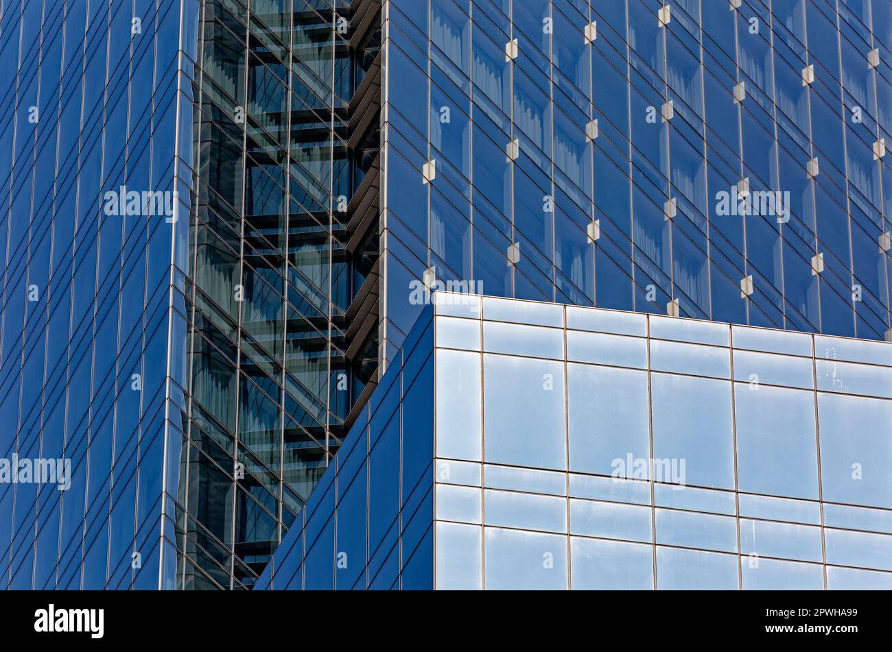 The blue glass curtain wall of Deutsche Bank Center’s North Tower is ...