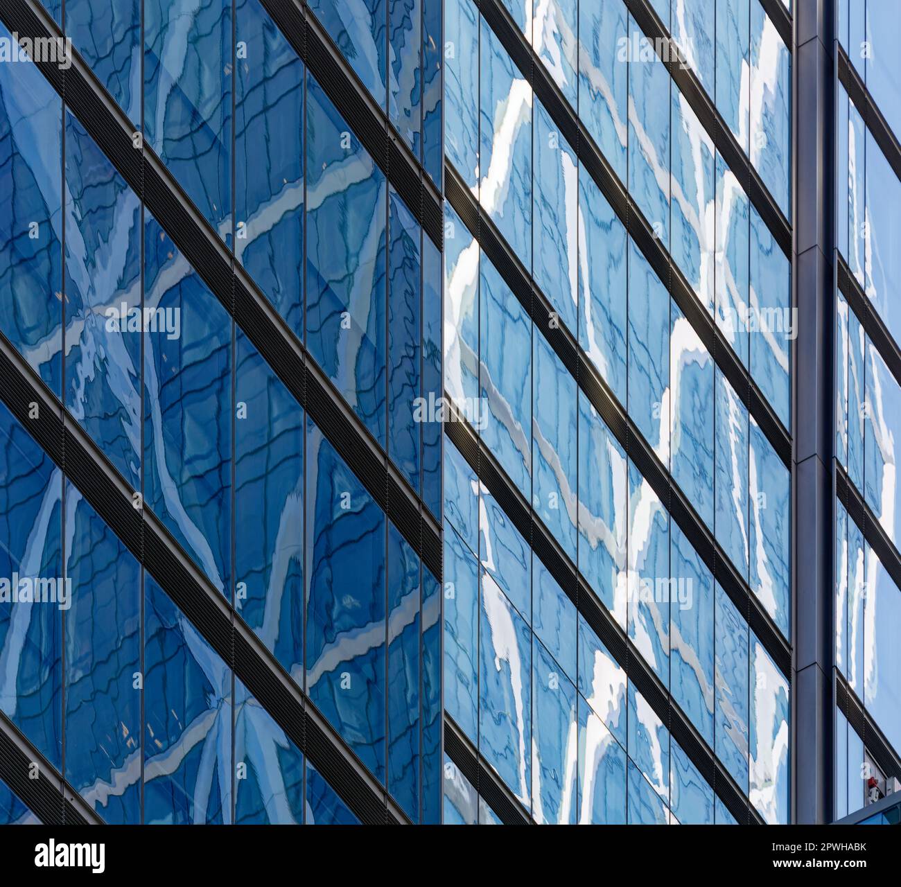 241 West 57th Street, a 1927 masonry office building re-clad in glass ...