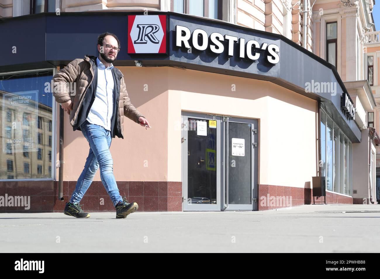 April 04.2023. Russia. Moscow. A man at the fast food restaurant Rostic's on the site of the ...