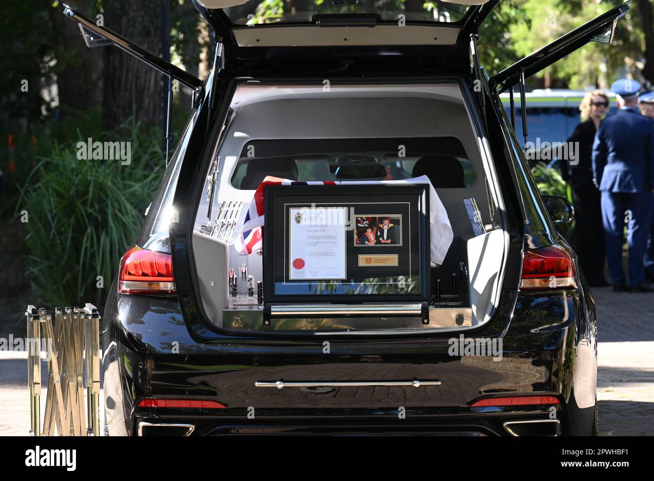 The casket of paramedic Steven Tougher arrives in a hearse to his ...
