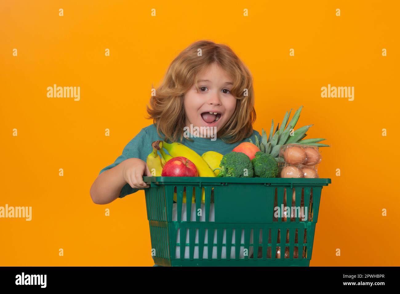 Grocery shop. Excited kid at vegetable supermarket. Child with shopping ...