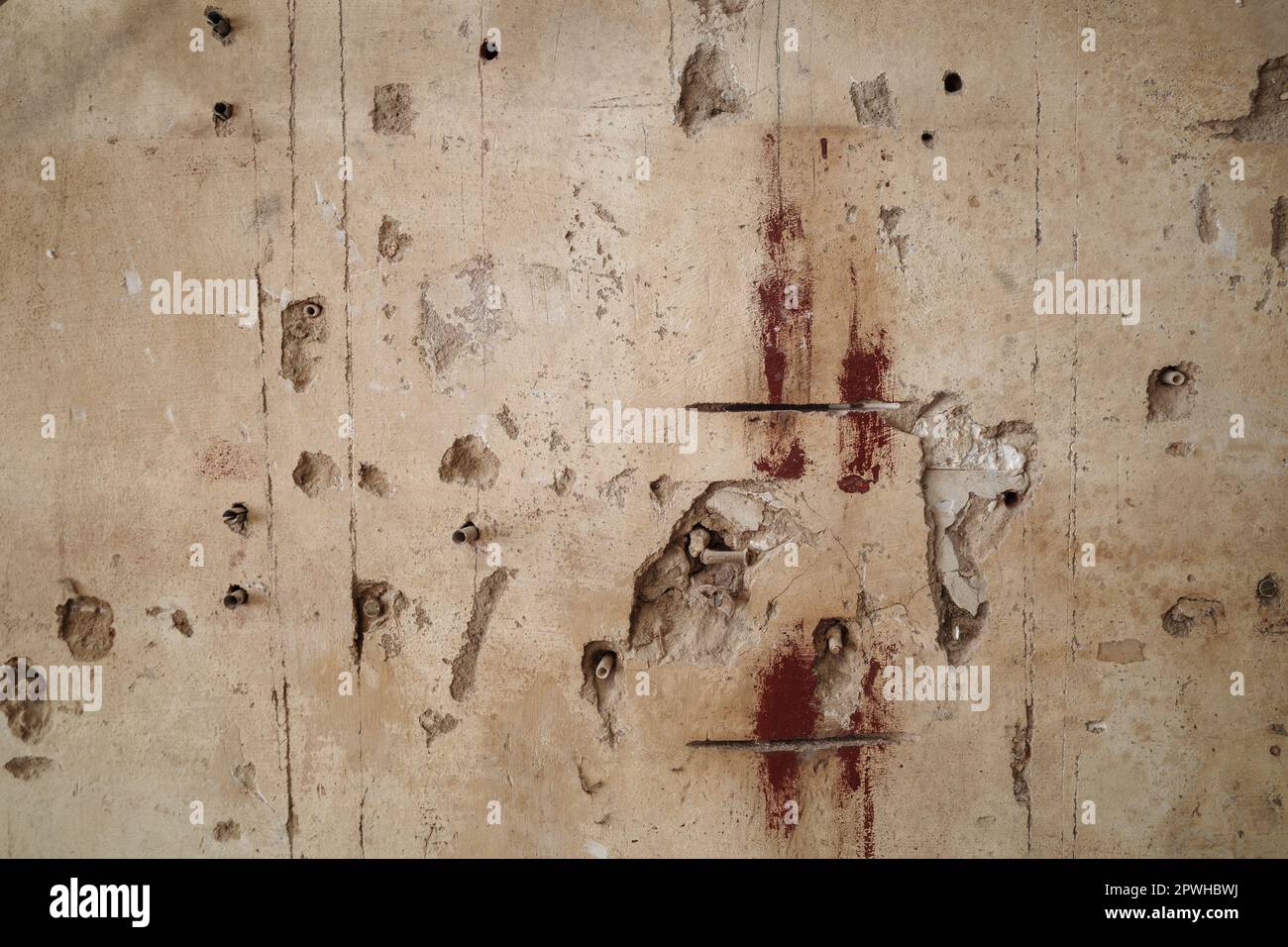 Rough concrete structural wall with scar of cracking plaster and stucco ...