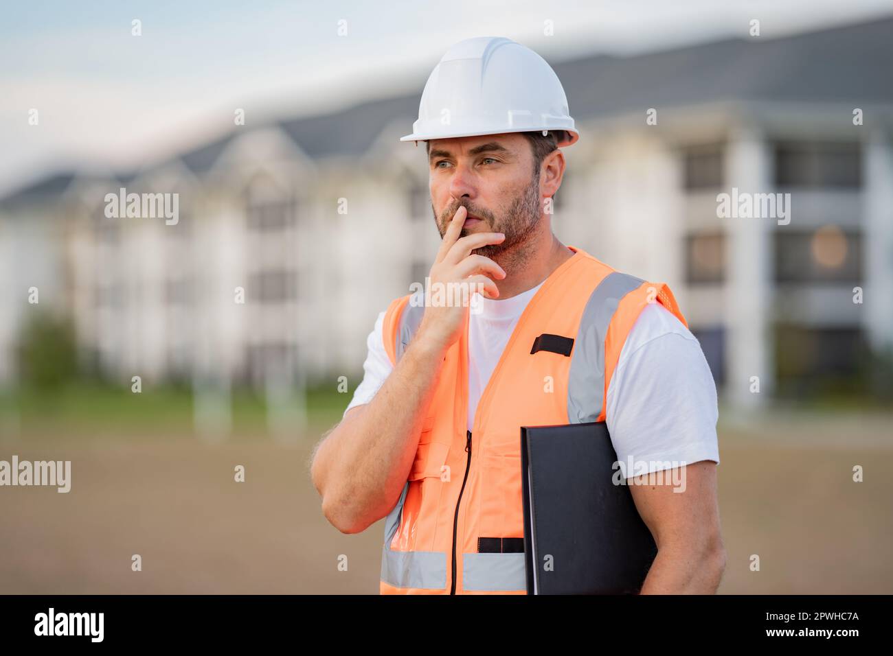 Builder thinking. Construction man in helmet build new house. Engineer ...