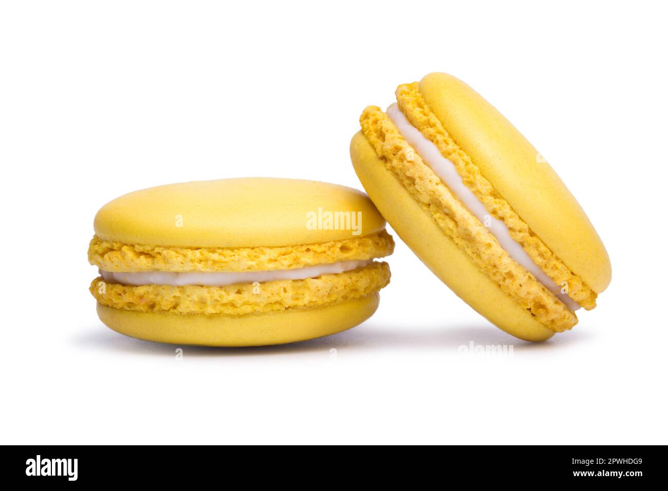 Yellow macaron cookies isolated on white background Stock Photo - Alamy